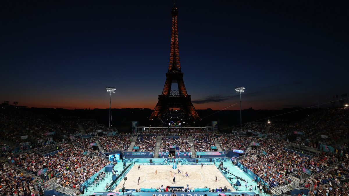 Beach volleyball at Eiffel Tower Stadium draws crowds looking for the ...