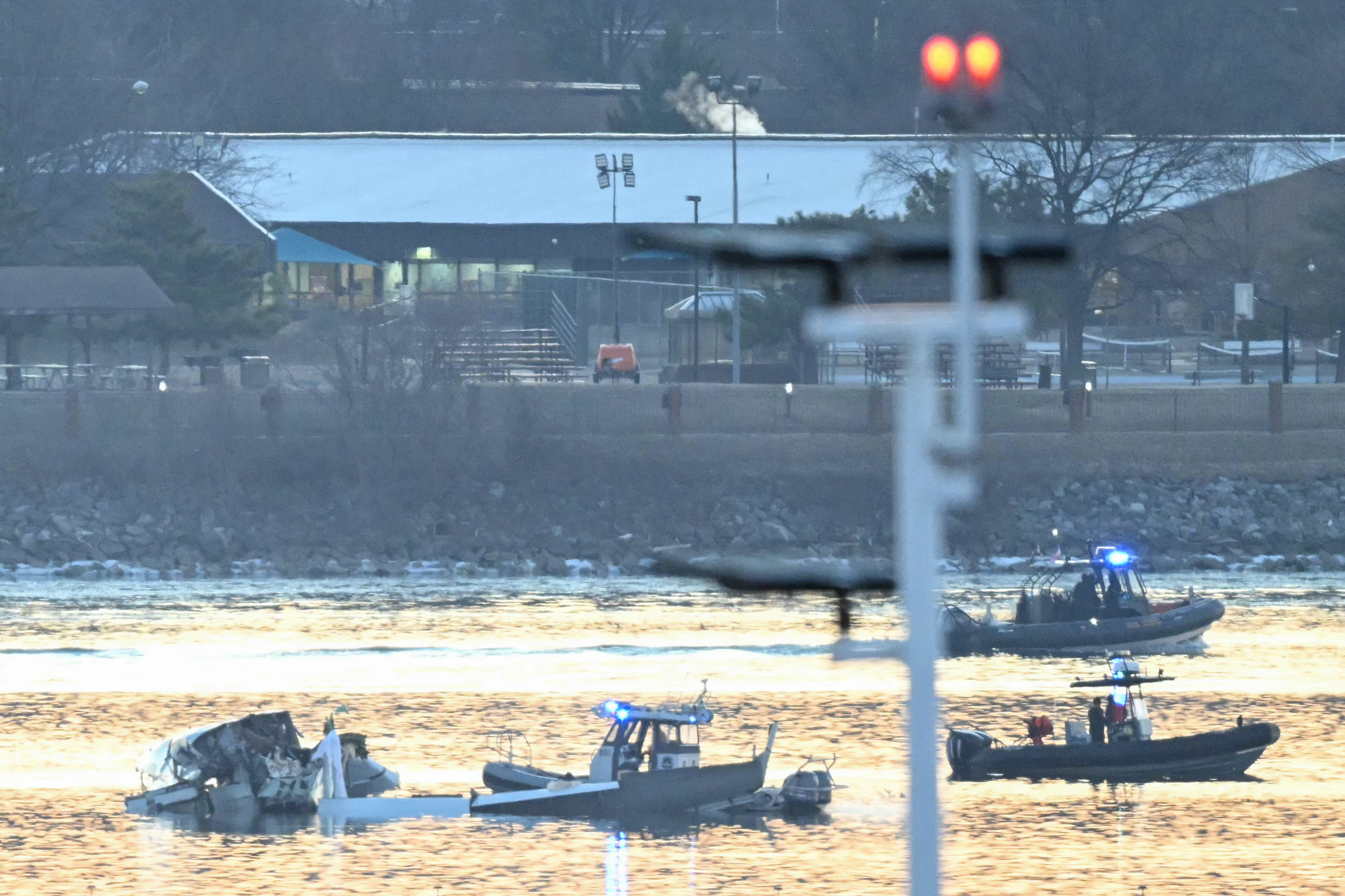 Photos: See aftermath of plane, helicopter crash in Potomac River ...